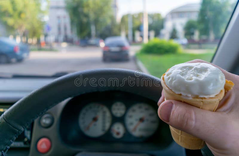Driver Holds the Ice Cream while Driving a Car Stock Image - Image of ...