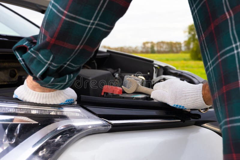 The Driver Inspects the Engine Compartment of the Car Stock Image ...