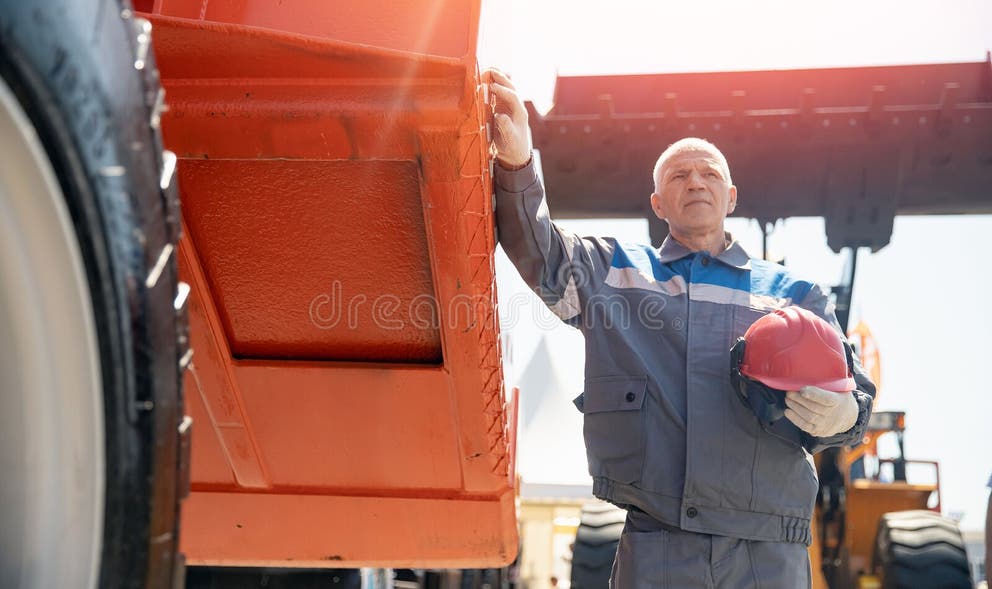 Driver Man of Construction Equipment Excavator or Tractor. Builder or ...