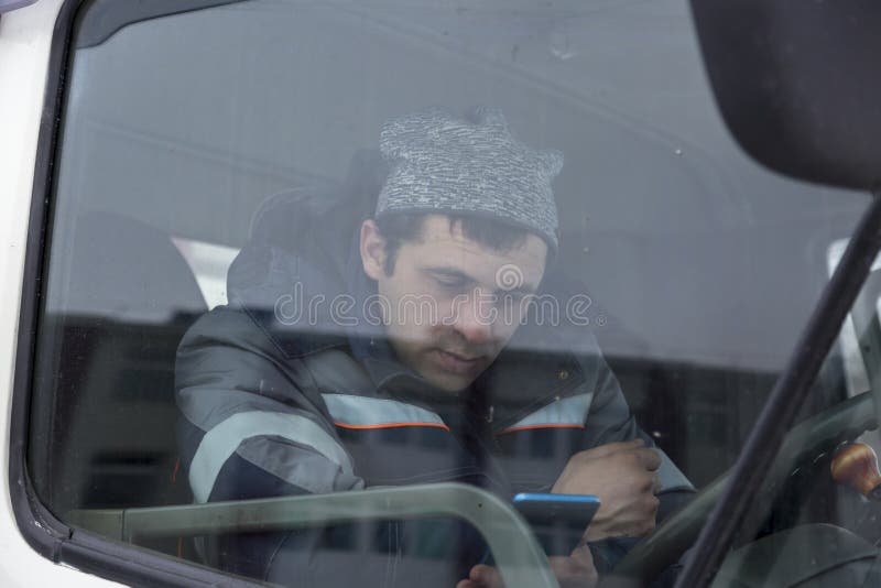 Driver with a Mobile Phone Driving a Truck Stock Image - Image of ...