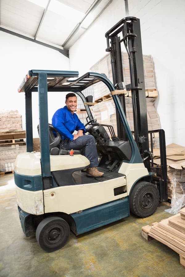 Driver Operating Forklift Machine in Warehouse Stock Photo - Image of ...