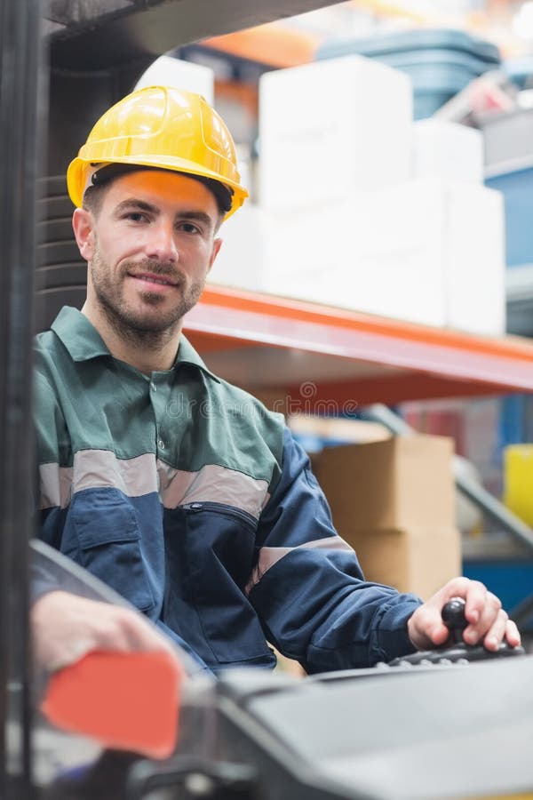 Driver Operating Forklift Machine in Warehouse Stock Photo - Image of ...