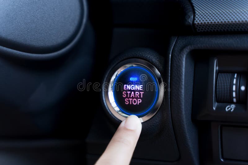 The Driver Palm As it Presses the Electric Car Engine Start Stop Button ...