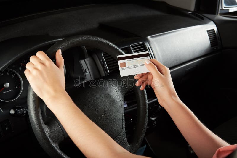 Driver Paying with Credit Card Stock Photo - Image of female, holding ...