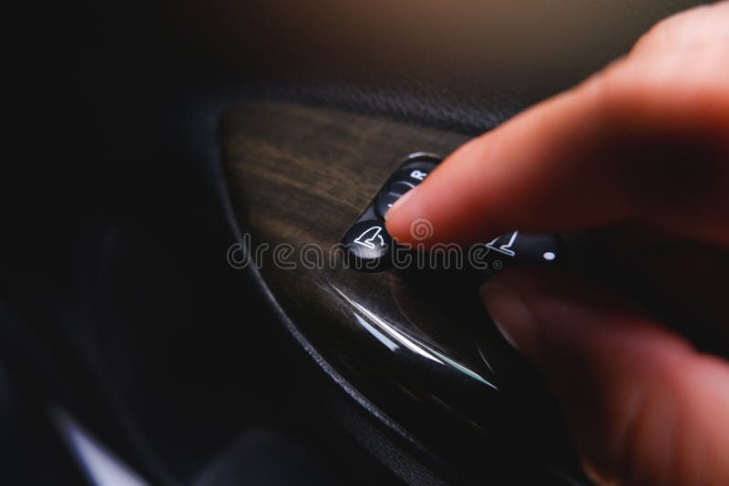The Driver Presses the Power Folding Mirror Button Switch with His Hand ...