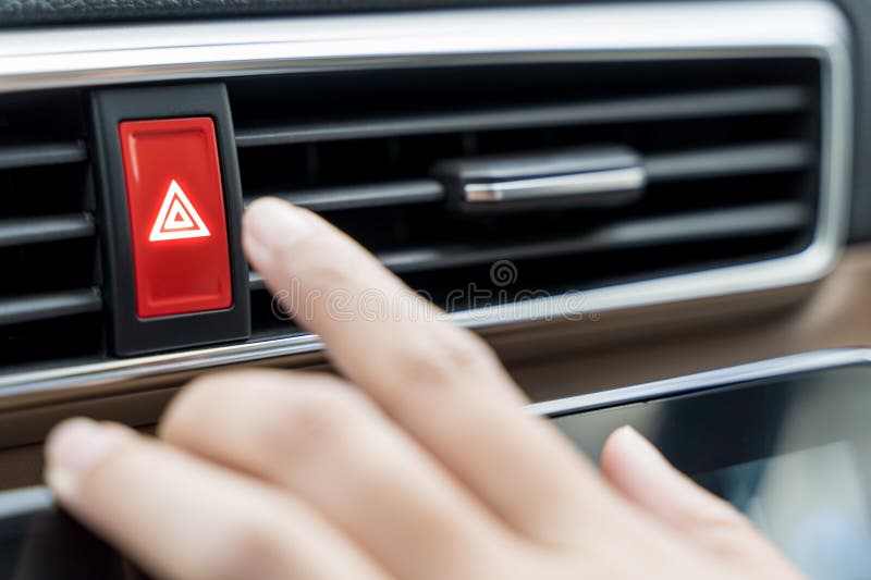 The Driver is Pressing the Emergency Stop Button on the Car Dashboard ...