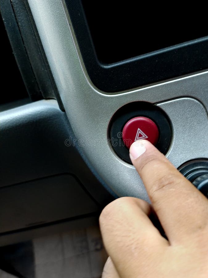 A Driver is Pressing the Hazard Light Button on Stock Image - Image of ...