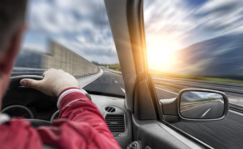The Driver Rushes by Car Along the Road. Speed Race in Motion. Stock ...