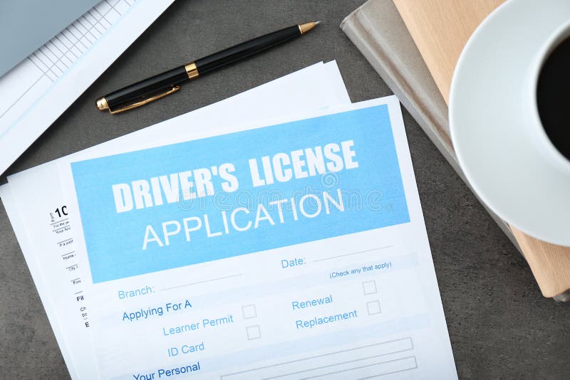 Driver`s License Application Form and Stationery on Grey Table, Flat ...