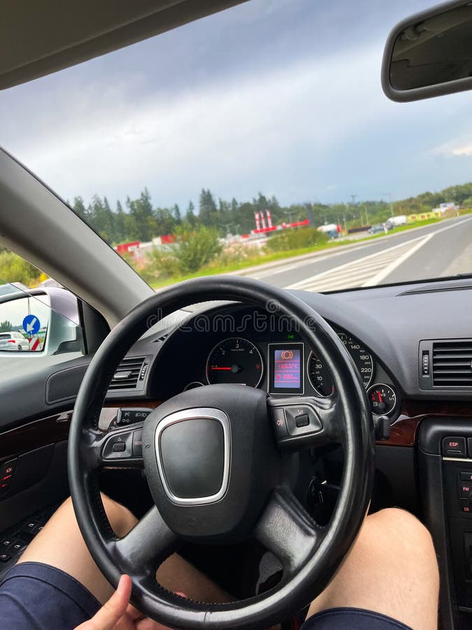 A Driver in Shorts is Driving a Car Stock Photo - Image of auto, driver ...