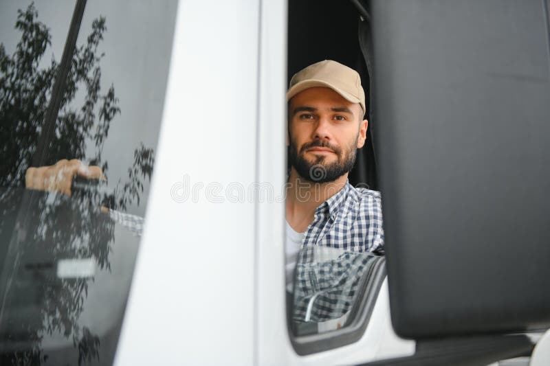 A Driver Sitting Inside the Semi-truck while Looking through the Open ...