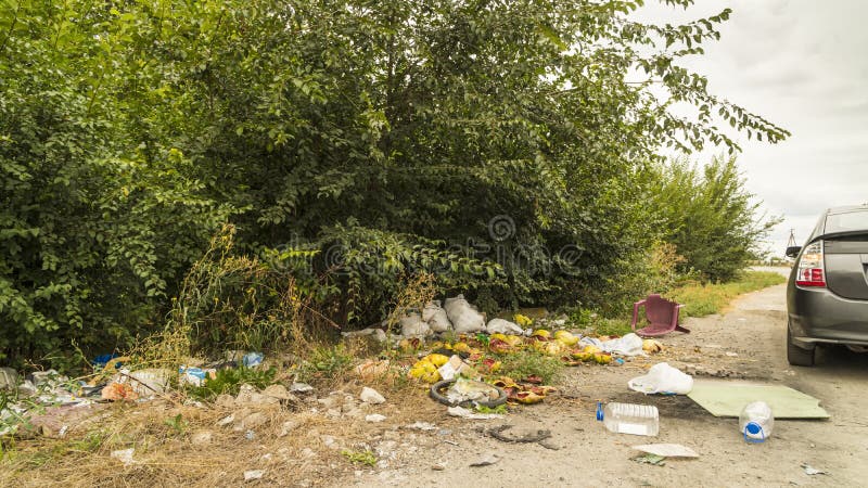 The Driver Throw Garbage on the Side of the Road. Stock Photo - Image ...