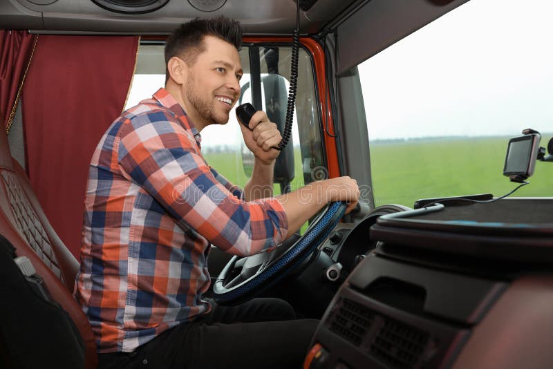 Driver Using CB Radio in Cab of Truck Stock Image - Image of person ...