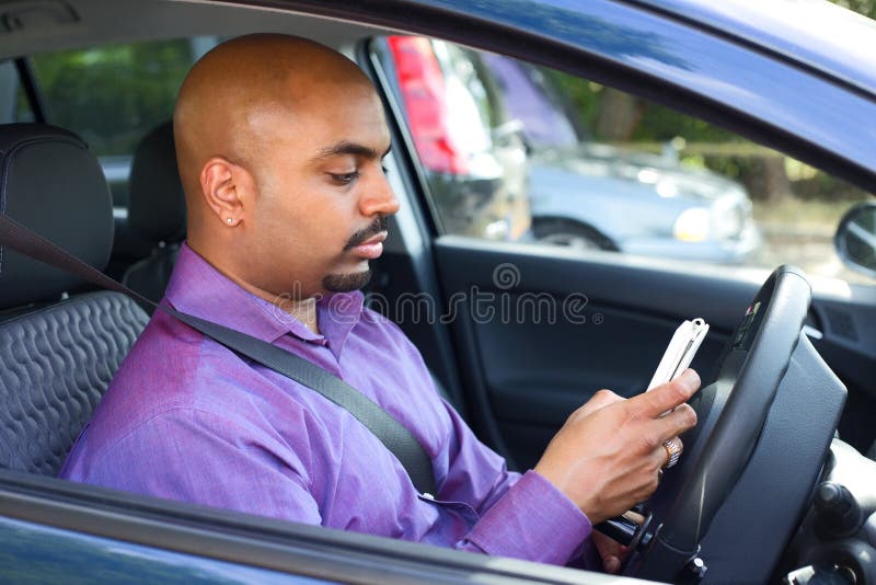Driver using mobile phone stock photo. Image of driving - 60997316