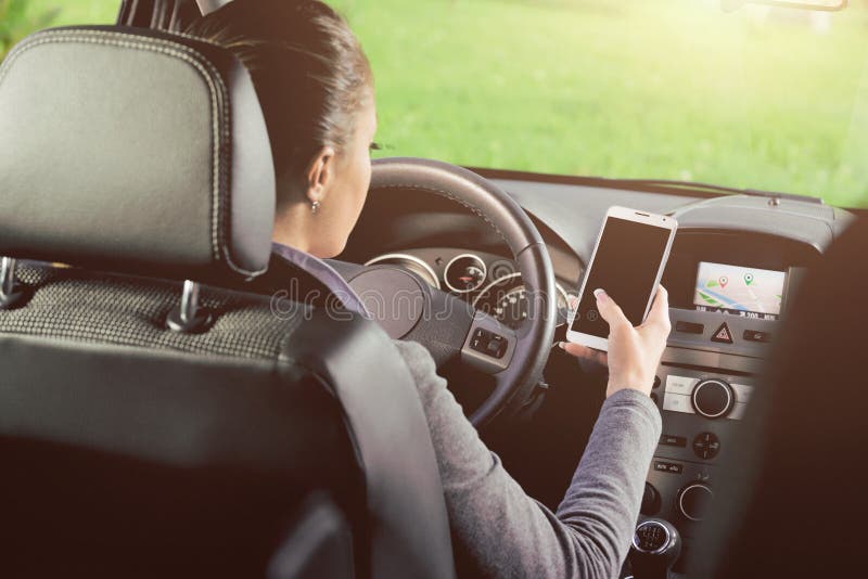 Driver Using Smartphone and Gps Navigation in a Car Stock Image - Image ...