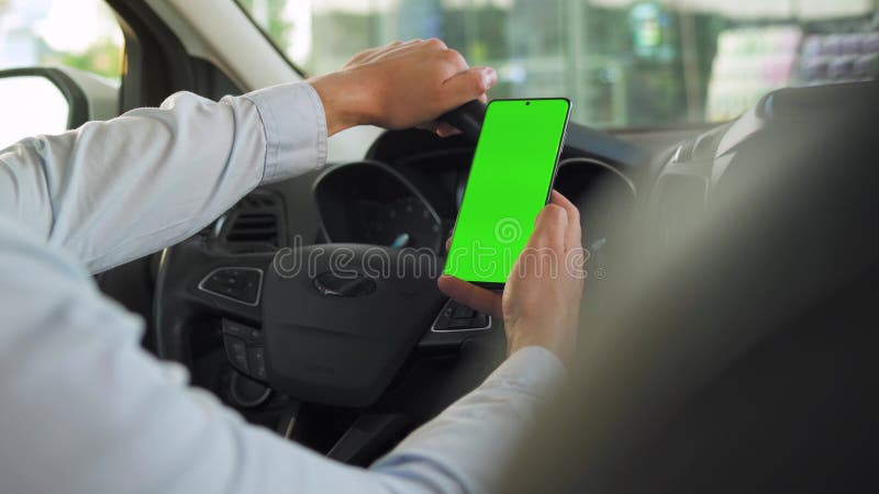 Driver Using a Smartphone Inside the Car. Chromakey Smartphone with ...