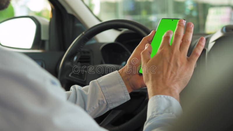 Driver Using a Smartphone Inside the Car. Chromakey Smartphone with ...