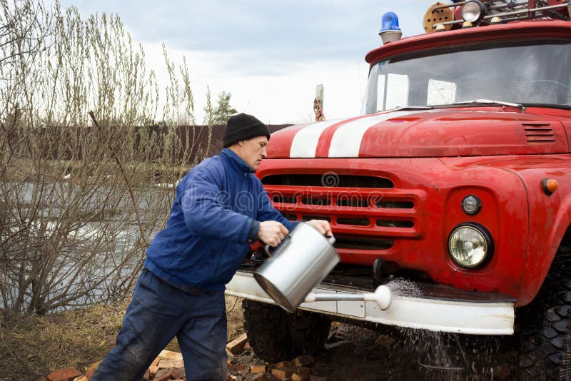 Driver of the Water Washes the Old Fire Truck Stock Image - Image of ...