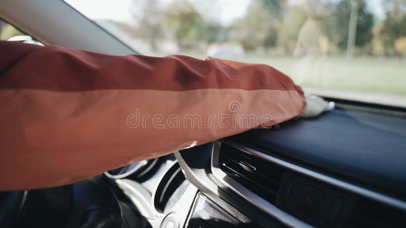 The Driver Wipes the Dust from the Dashboard of the Car. Stock Footage ...