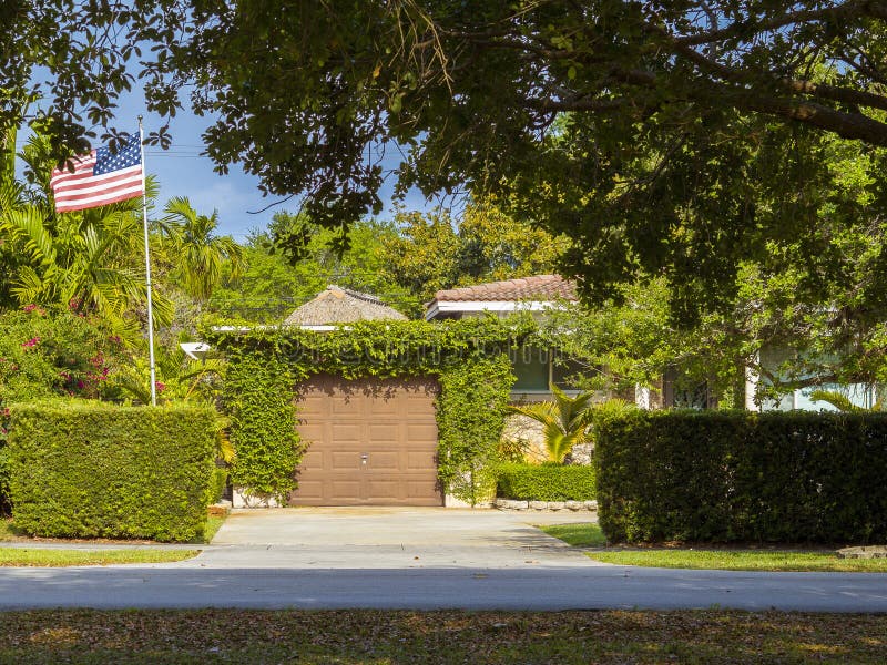 Driveway with American Flag on House Gate Stock Image - Image of ...