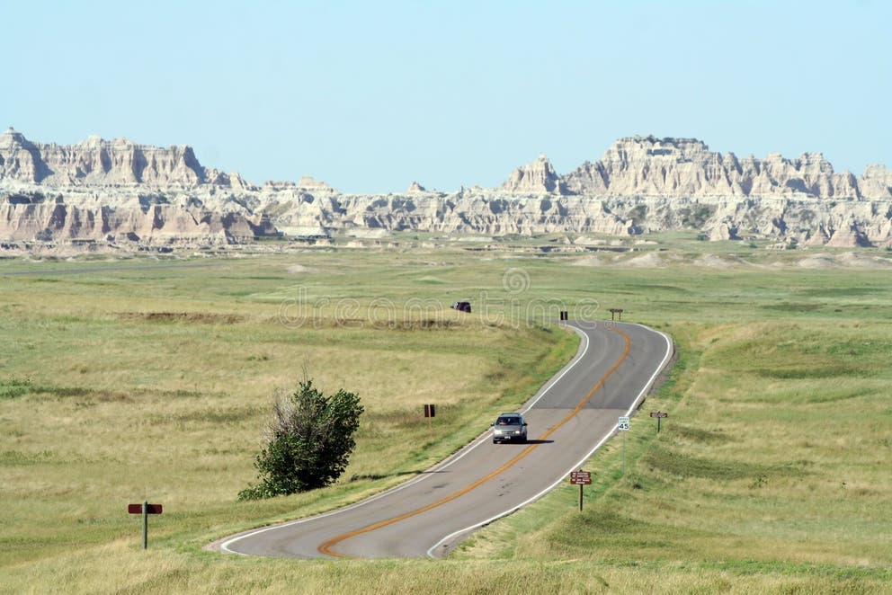 Driving through Badlands National Park Stock Image - Image of desolate ...