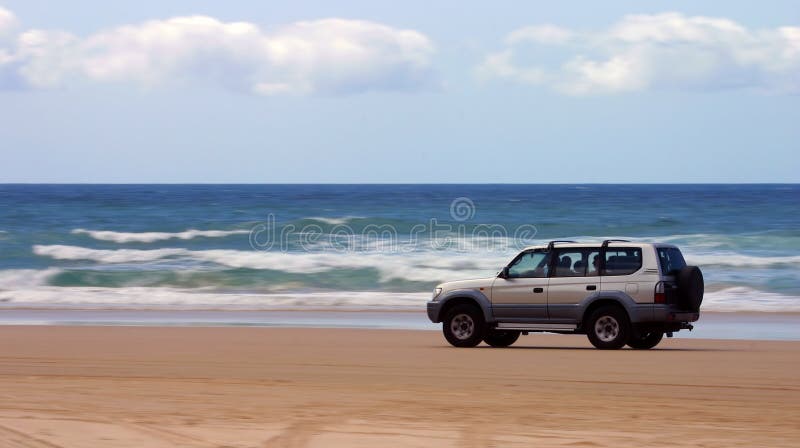 Driving on the beach stock photo. Image of blur, ocean - 1418792