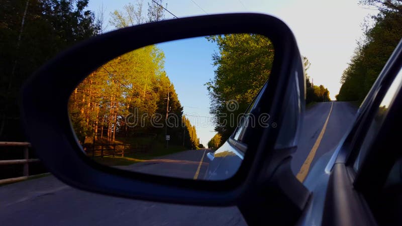 Driving Bumpy Rural Road View of Side Mirror in Daytime. Driver Point ...