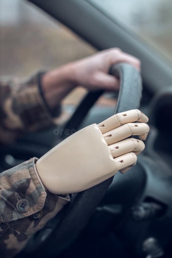 Man with Artificial Hand Driving a Car Stock Photo - Image of human ...