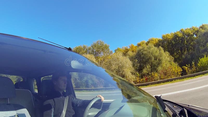 Driving a Car, Camera Aimed at the Driver through the Windshield. Stock ...