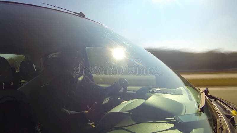 Driving a Car, Camera Aimed at the Driver. Stock Footage - Video of ...