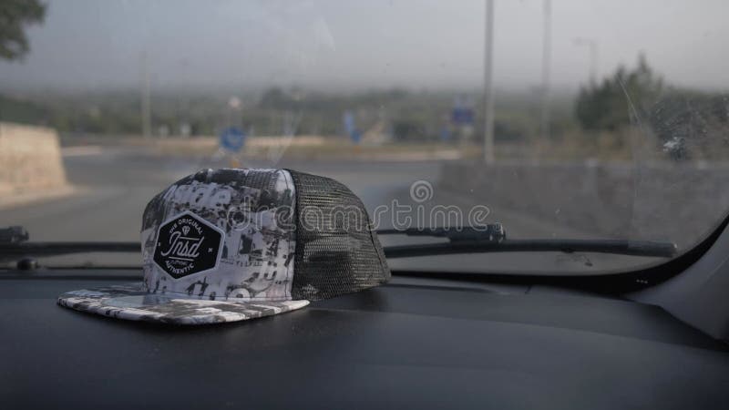 Driving a Car with a Cap in the Dashboard Stock Footage - Video of ...