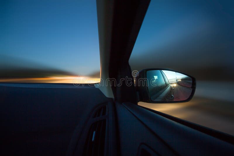 Driving Car at Dusk stock photo. Image of business, automobile - 100486748