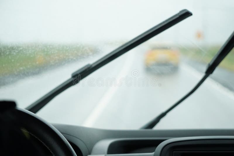 Driving a Car in the Rain with Activated Windshield Wipers Stock Photo ...