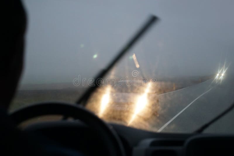 Driving a Car in the Rain with Activated Windshield Wipers Stock Photo ...