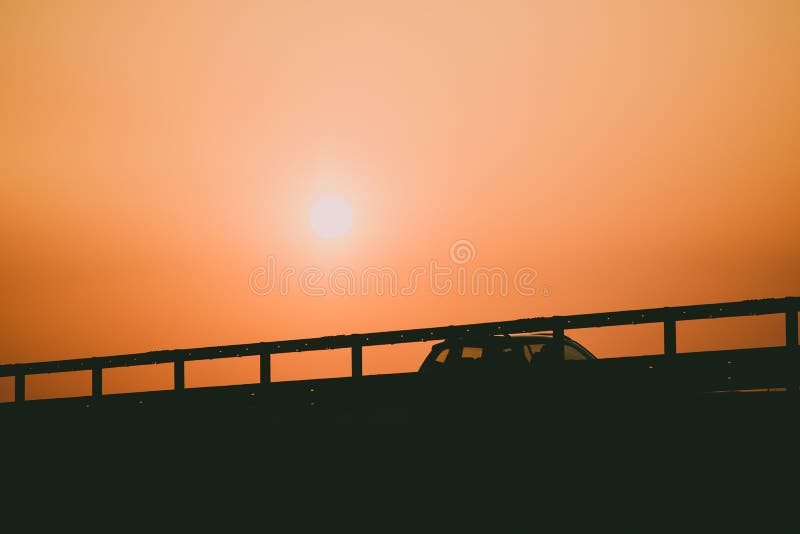Driving a Car at Sunset on the Highway Car Travel Concept Stock Photo ...