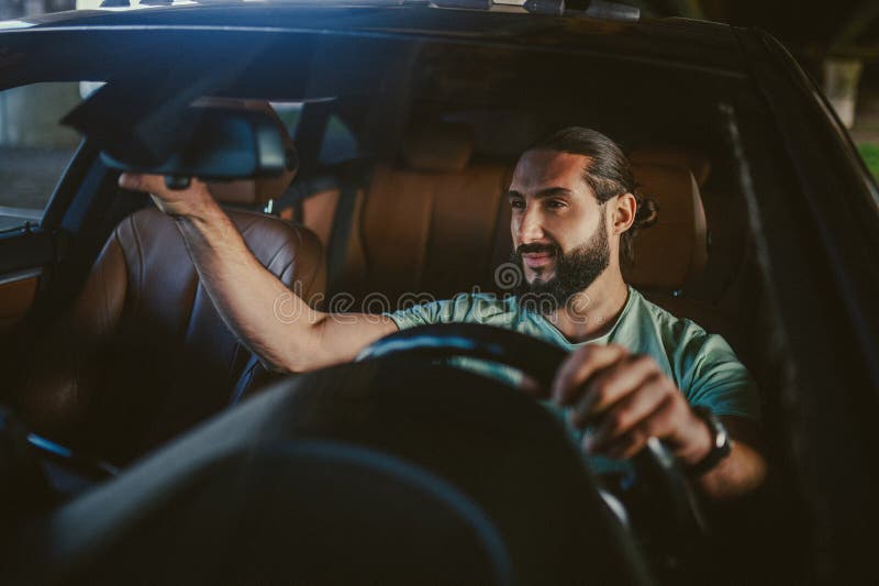 Young Handsome Dark-haired Man Driving a Car Stock Photo - Image of ...