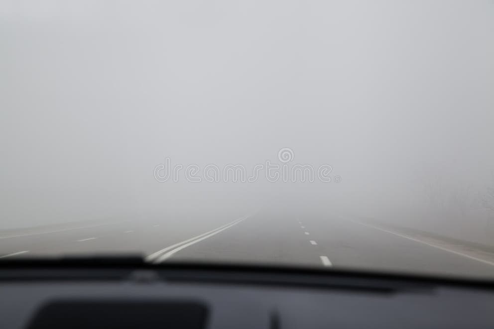 Driving in a dense fog stock image. Image of evening - 97795403
