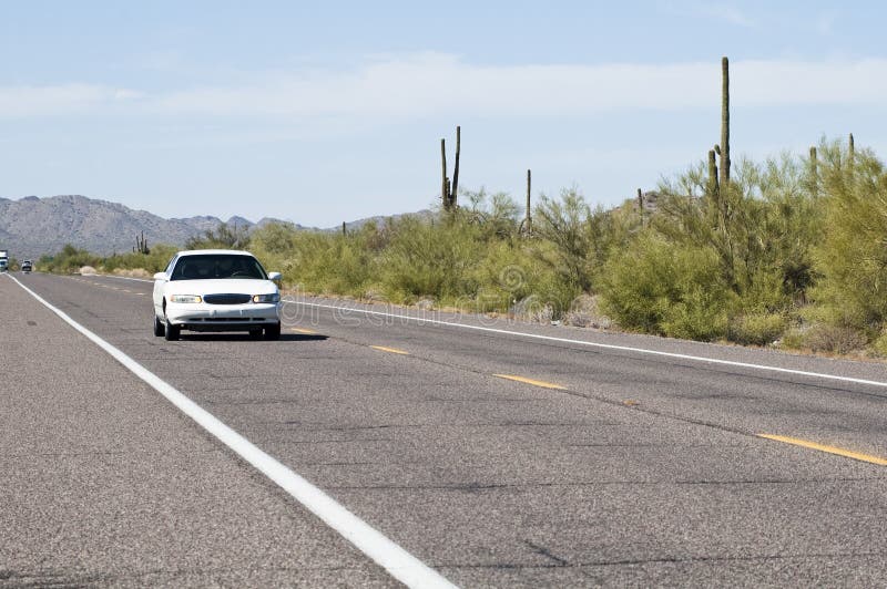 Driving in the desert stock photo. Image of saguaro, transportation ...