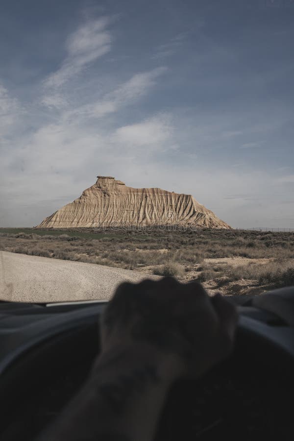 Driving through a Desert. in the Background a Rocky Mountain Stock ...