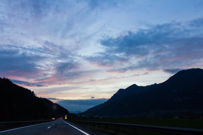 Driving at dusk stock image. Image of outdoors, environmental - 262115851