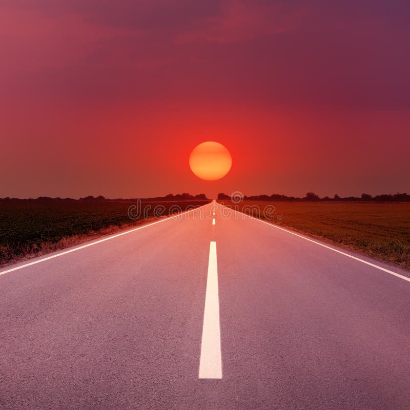 Driving on an Empty Highway Towards the Setting Sun Stock Photo - Image ...