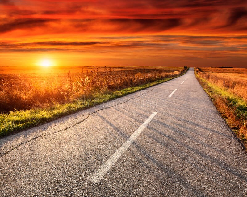 Driving on an Empty Road at Sunset Stock Photo - Image of meadow, line ...