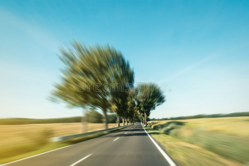 Driving Fast on Road in Rural Landscape - Motion Blur Stock Image ...