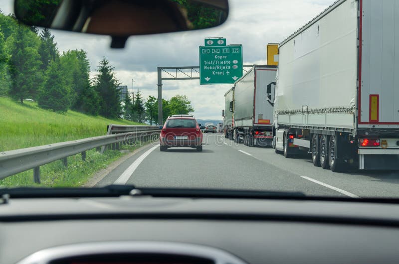 Driving on a Highway and Passing by a Row of Trucks Stock Image - Image ...