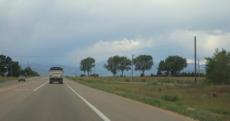 Driving on Highway with Trees and Mountains in Background Stock Image ...