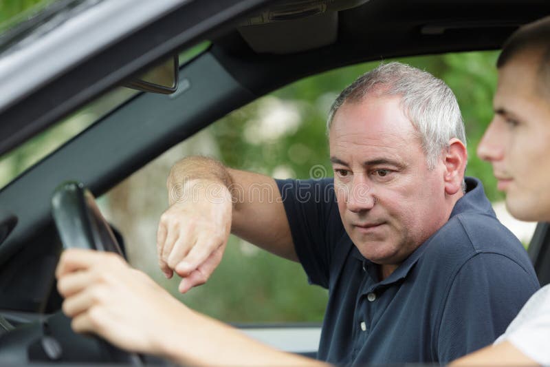Driving Instructor with Student in Car Stock Photo - Image of retro ...
