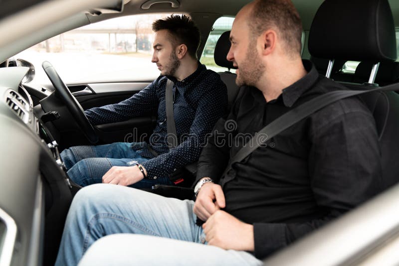 Driving Instructor and Man Student in Examination Car Stock Photo ...