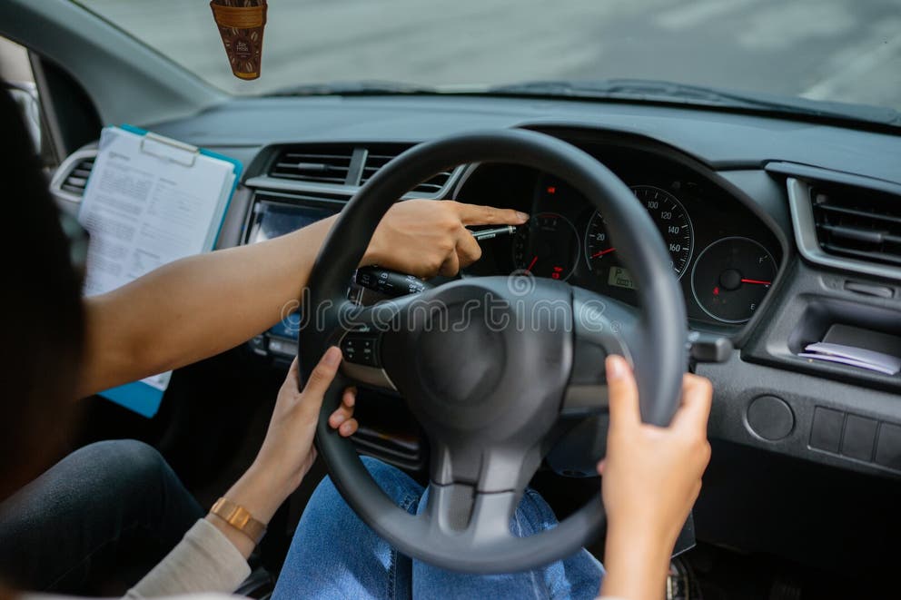 An Instructor Guides a Student Driver on the Importance of Dashboard ...