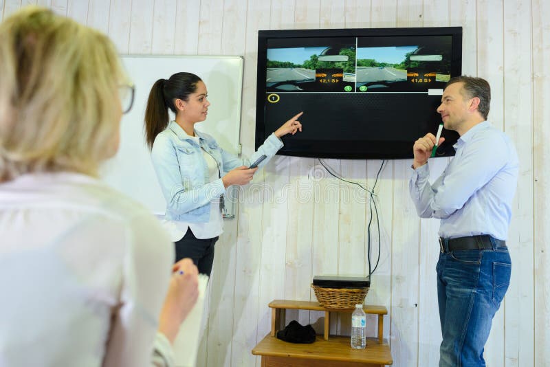 Driving Instructor and Student in Class Stock Image - Image of ...