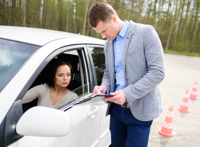 Driving Instructor and Woman Student Stock Photo - Image of ...